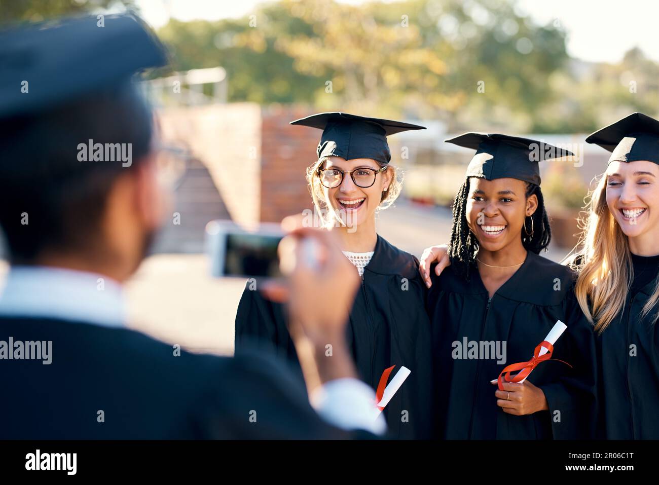 Capturing some memories of their milestone. a group of students taking ...