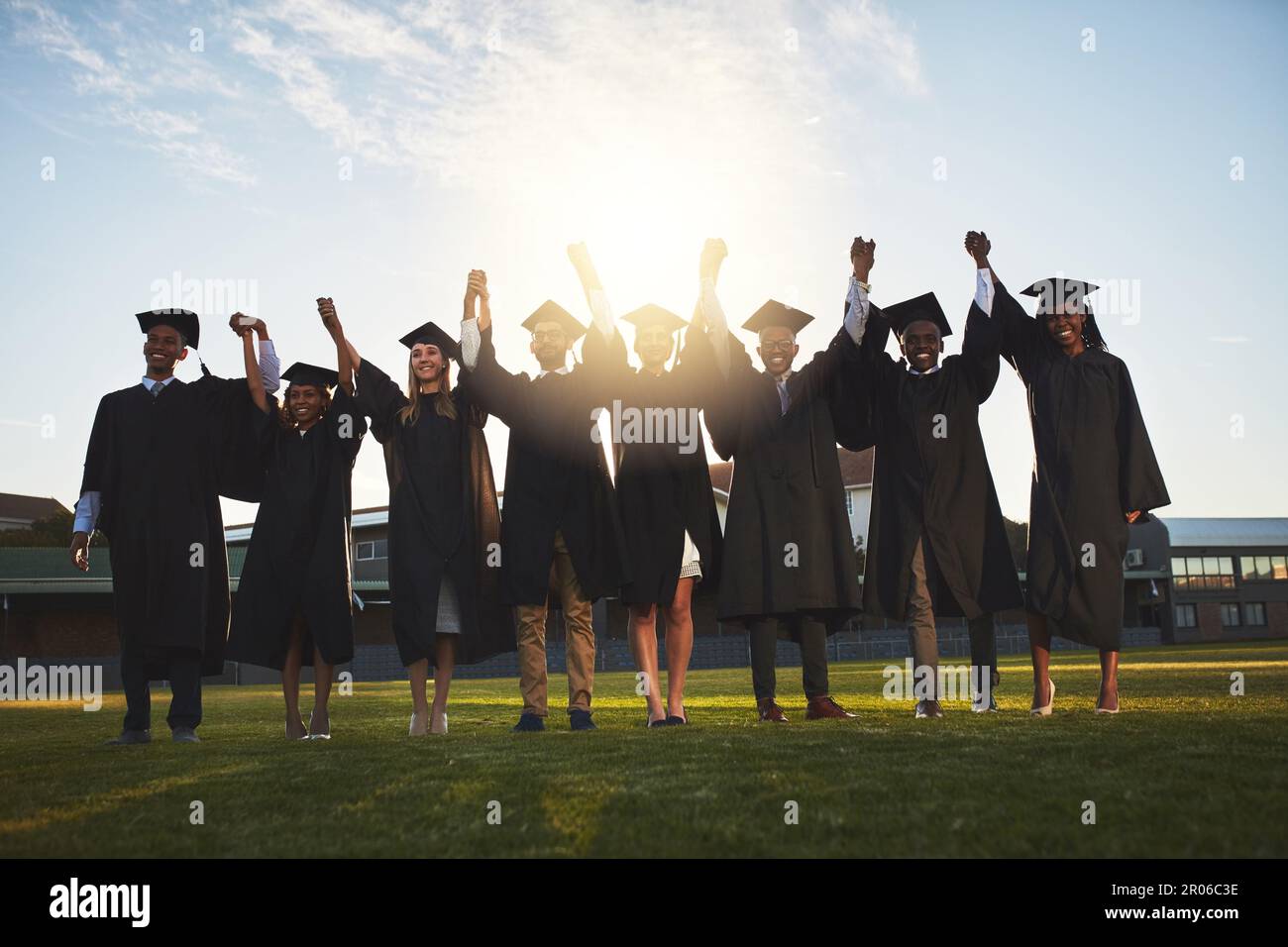 Congratulations are in order. a group of university students standing ...