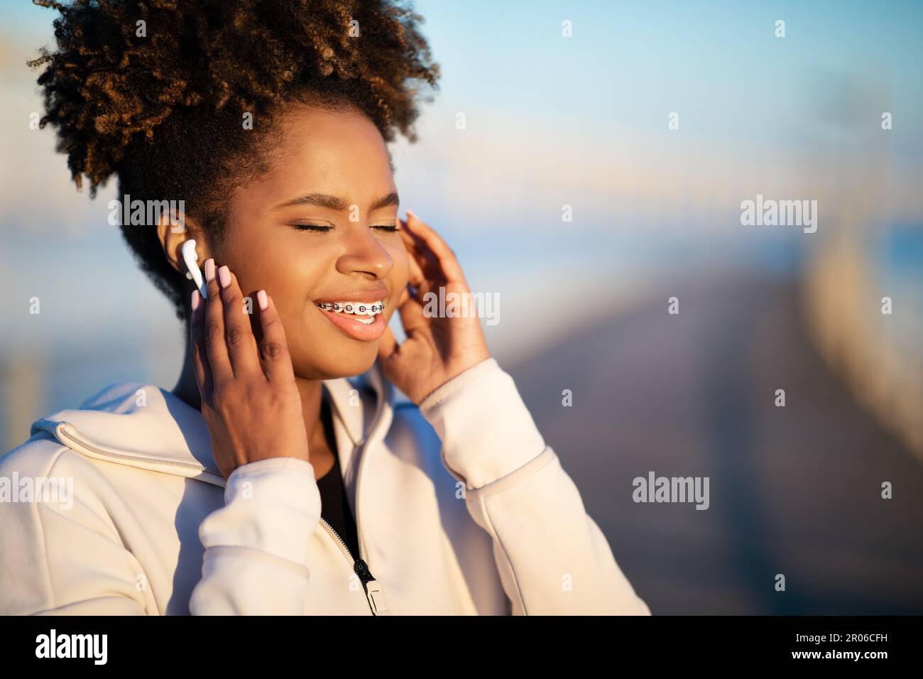 Beautiful woman wireless earphones enjoying hi-res stock photography ...
