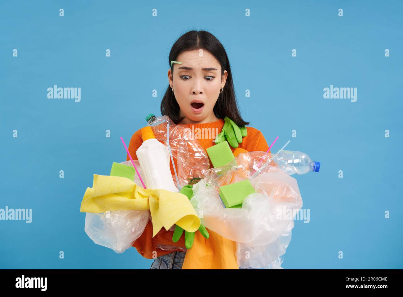 Shocked eco activist, collects loads of plastic to recycle, looking ...