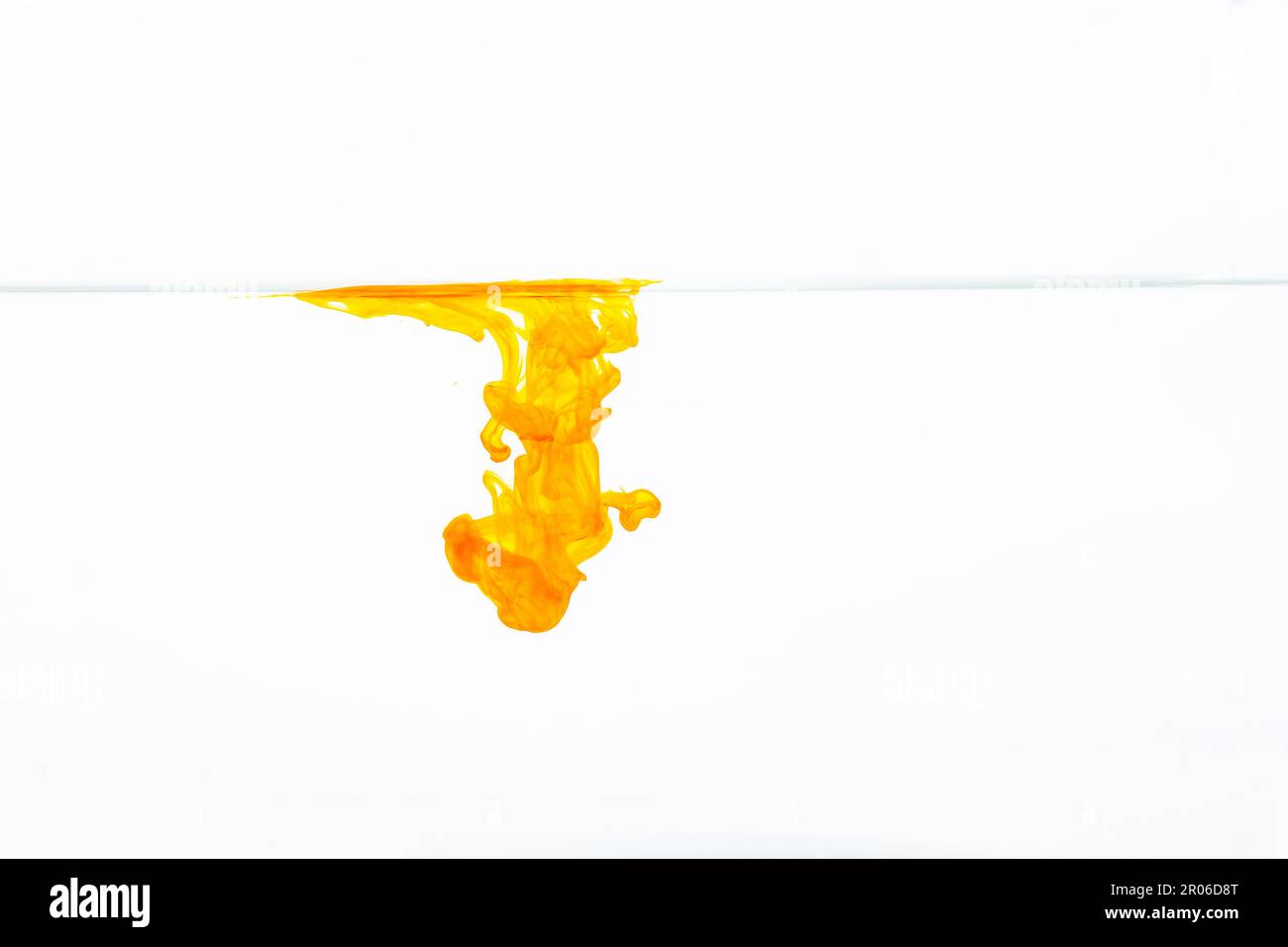 Orange ink drop in water, abstract orange ink in water on white ...