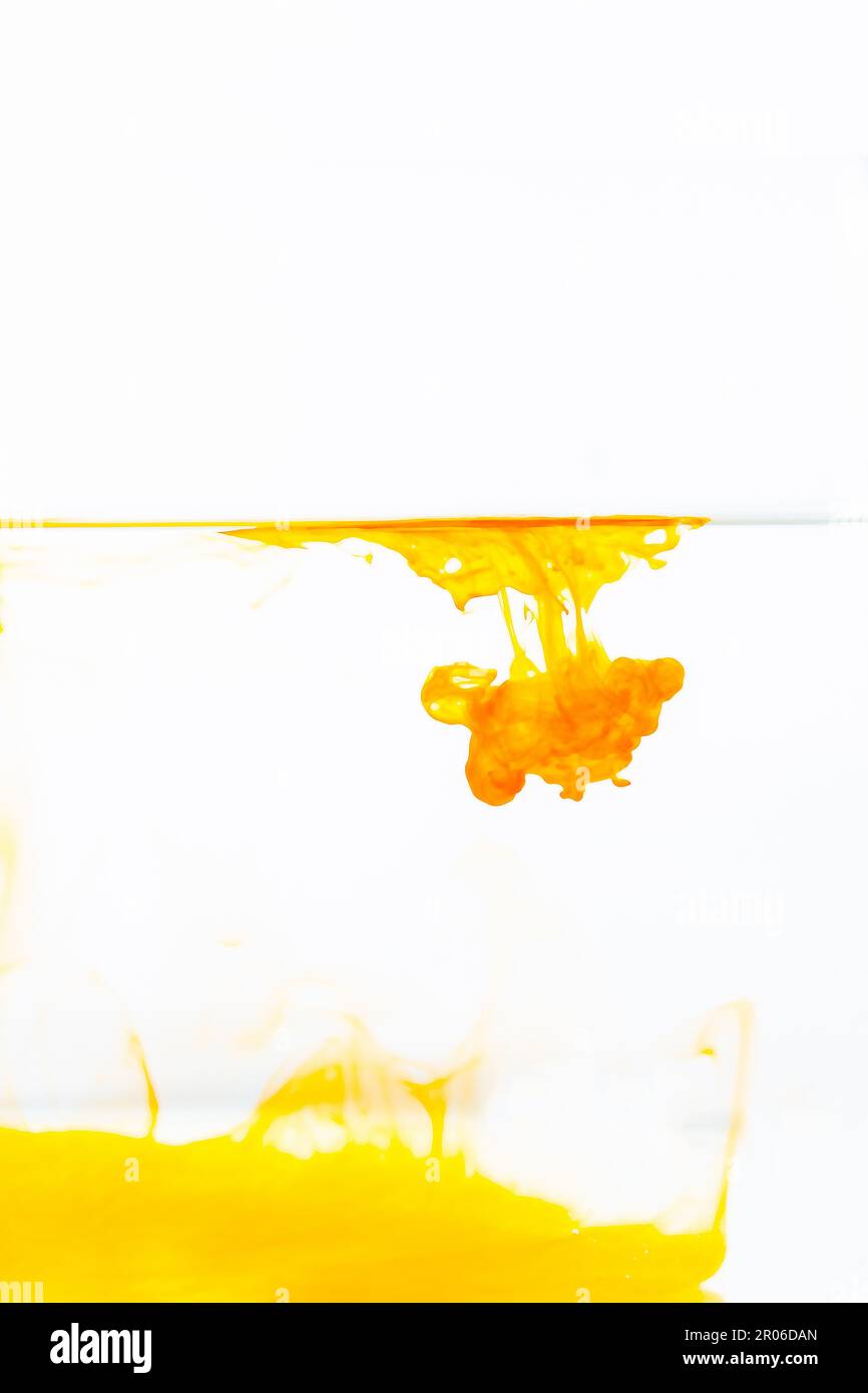 Orange ink drop in water, abstract orange ink in water on white ...