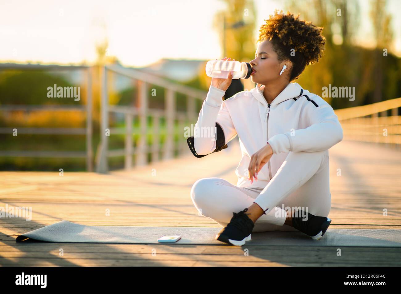 Thirsty Young African American Woman Drinking Water During Outdoor ...