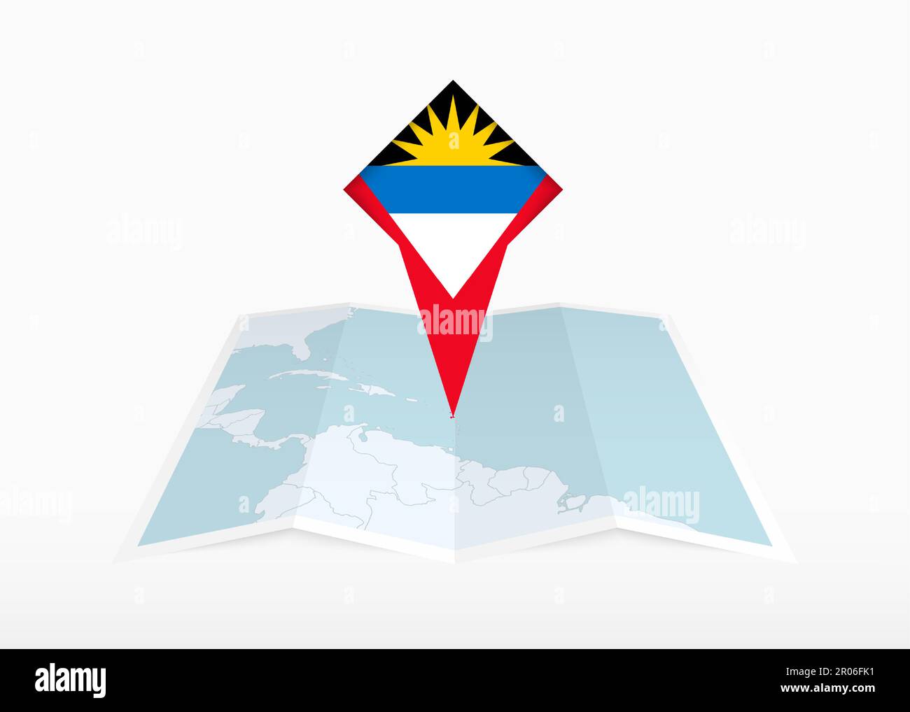 Antigua and Barbuda is depicted on a folded paper map and pinned ...