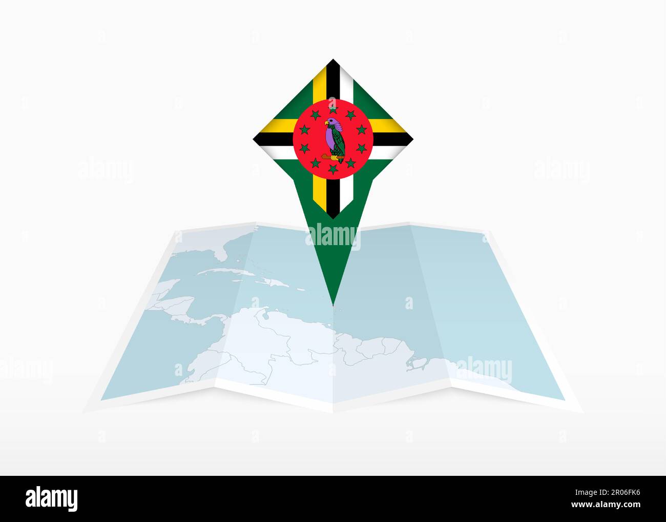 Dominica is depicted on a folded paper map and pinned location marker with flag of Dominica ...