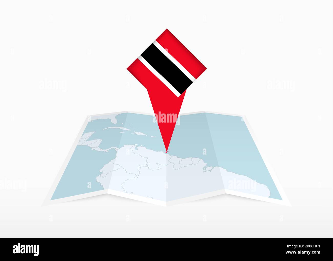 Trinidad and Tobago is depicted on a folded paper map and pinned location marker with flag of ...