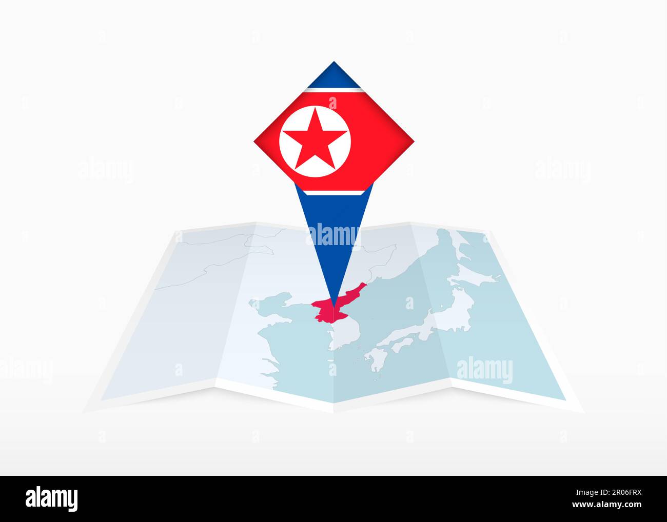 North Korea is depicted on a folded paper map and pinned location ...