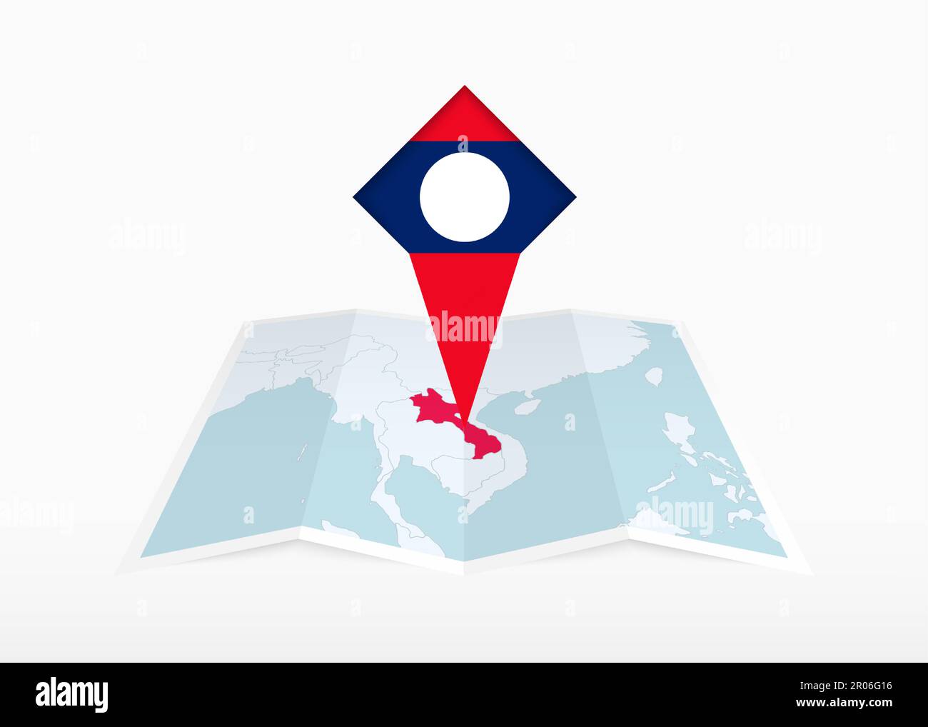 Laos is depicted on a folded paper map and pinned location marker with ...