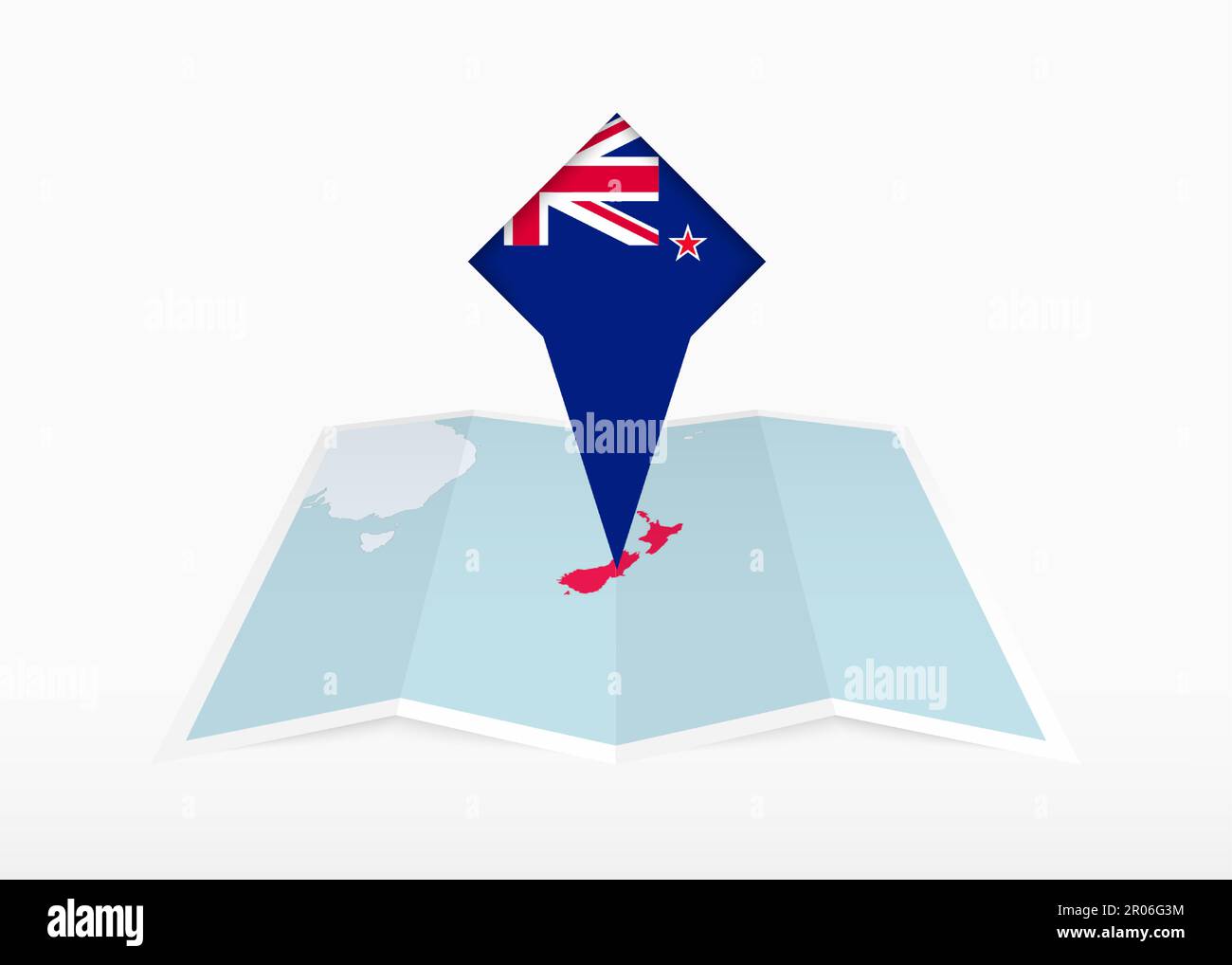New Zealand is depicted on a folded paper map and pinned location ...