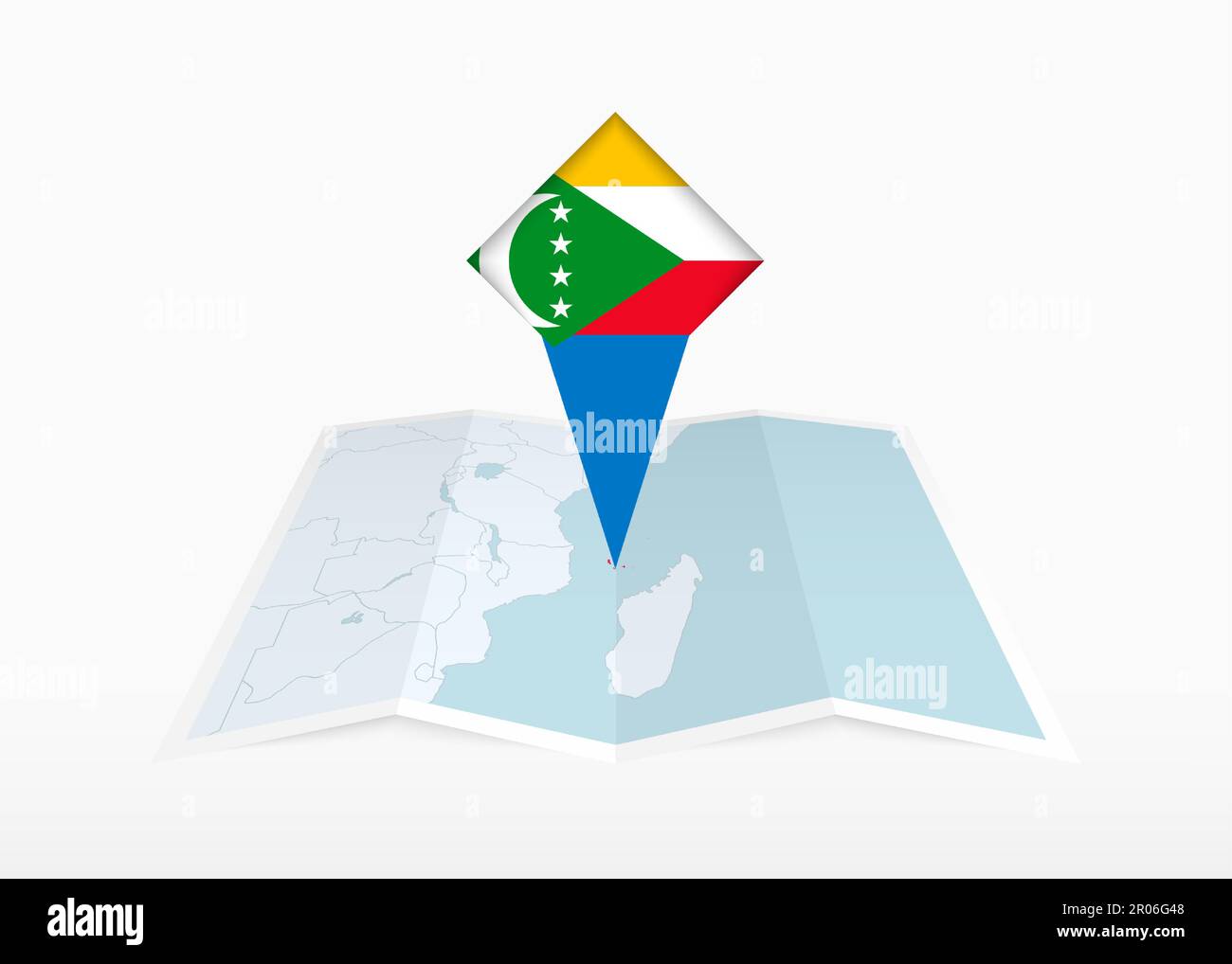 Comoros is depicted on a folded paper map and pinned location marker ...