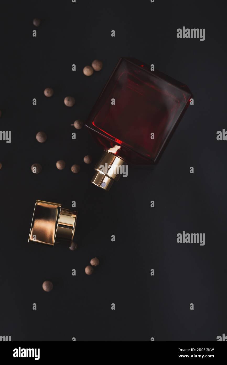 Perfume bottle on dark background Stock Photo - Alamy