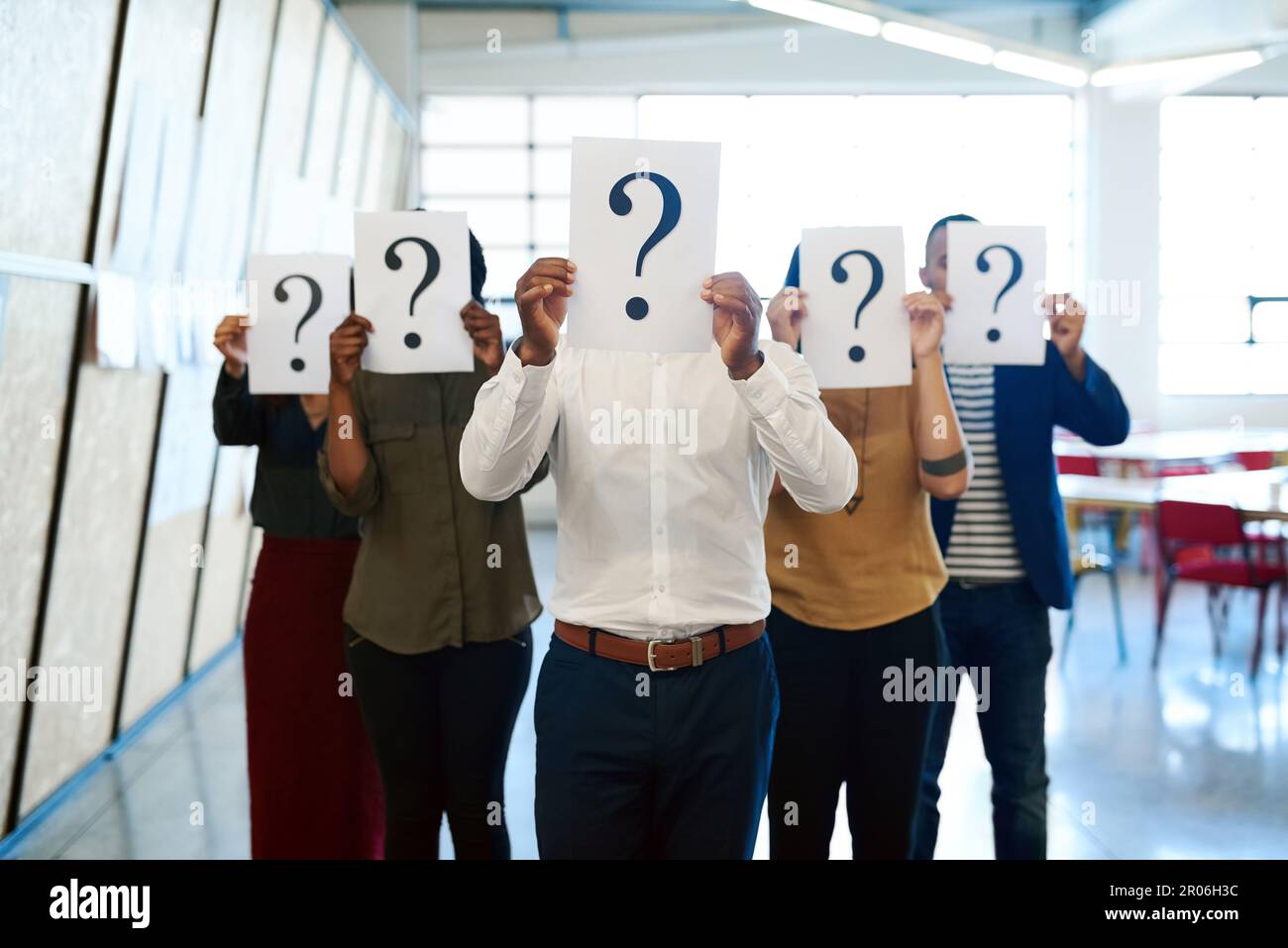 Business team holding question marks hi-res stock photography and ...
