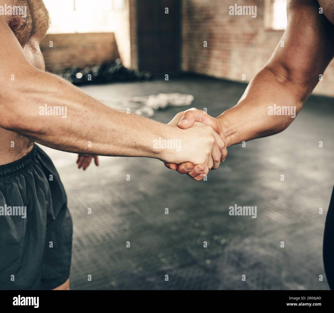 Double the strength. two unrecognizable men greeting each other with a ...