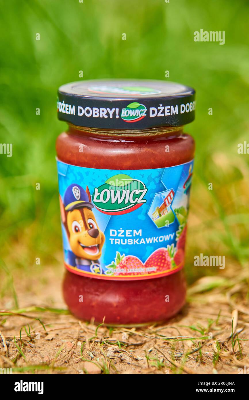A glass jar of Polish Lowicz brand strawberry jam with Paw Patrol ...