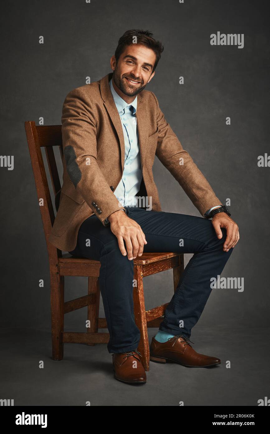 The power pose to go with the power outfit. Studio shot of a handsome ...