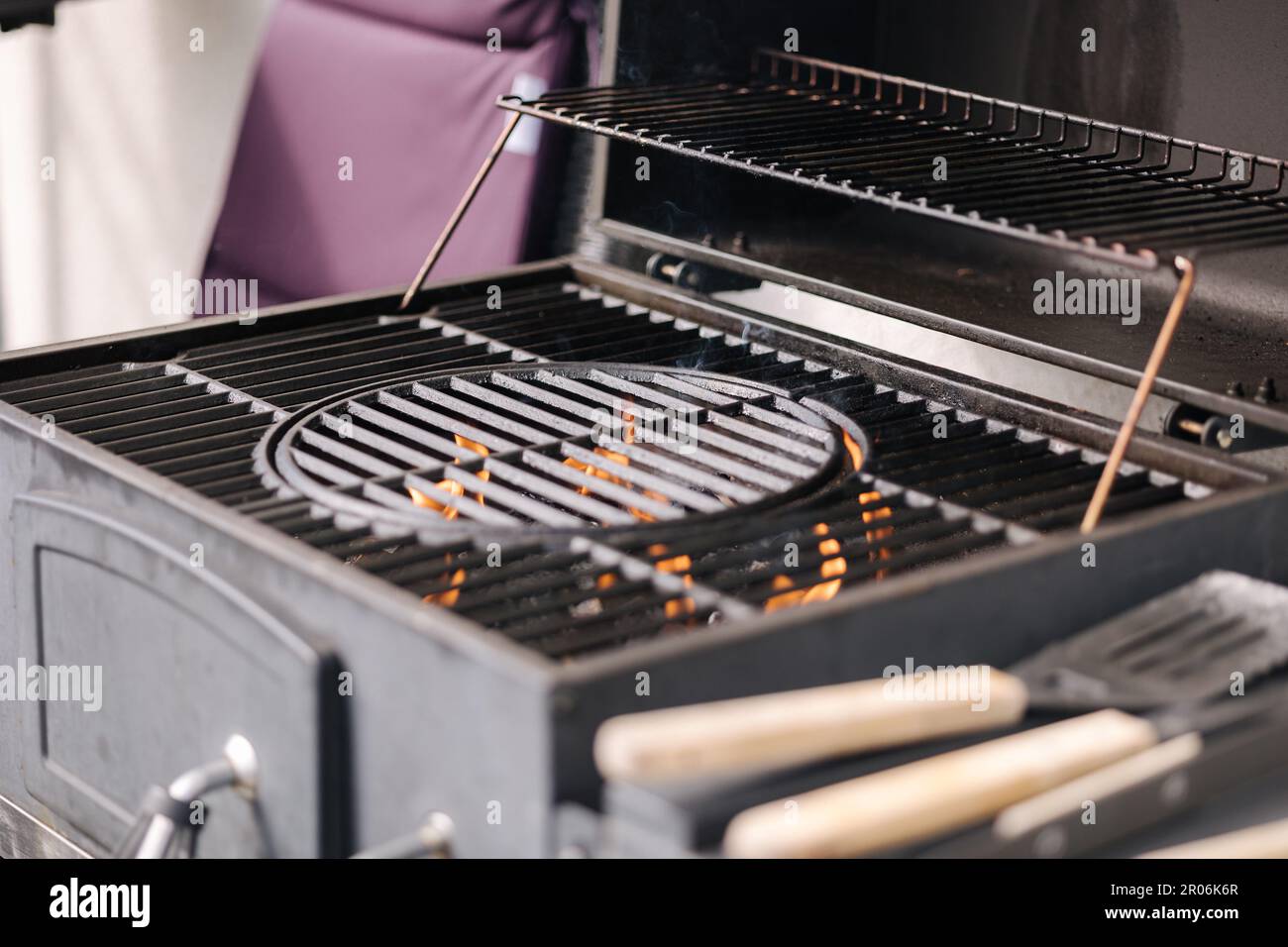 Photo of empty BBQ grill. The fire is burning Stock Photo - Alamy