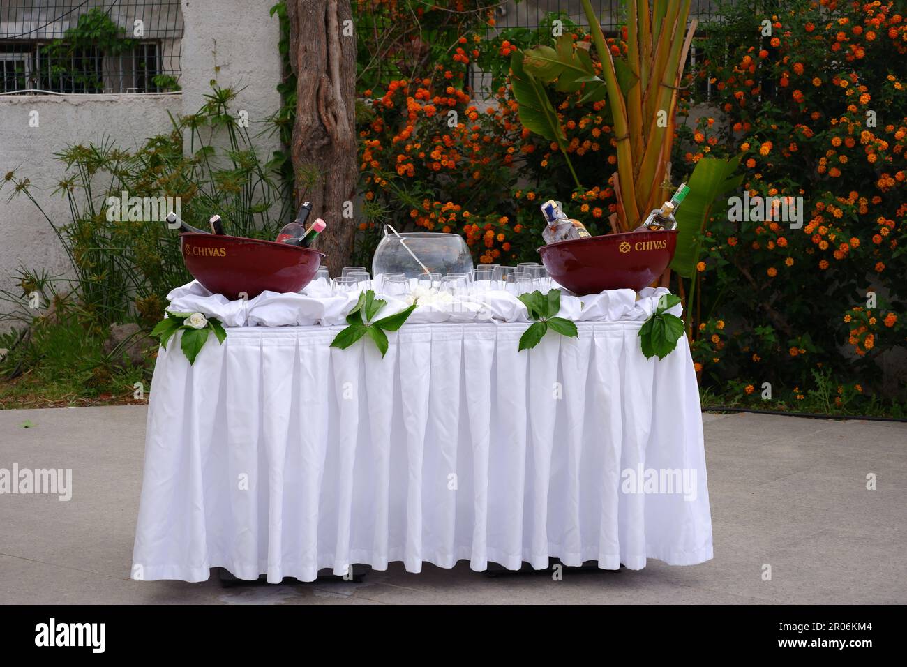 Drinks on table with white sheet outdoor for party preparation Stock ...