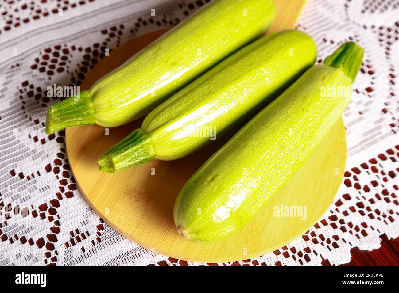 Fresh green courgettes in the kitchen, in natural light Stock Photo - Alamy