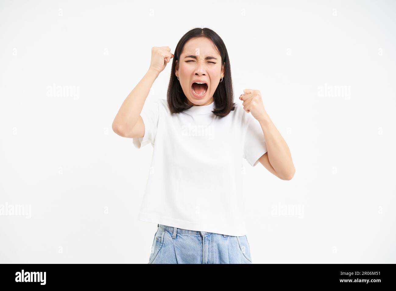 Angry korean woman, screaming and shouting, looking hurt and frustrated ...