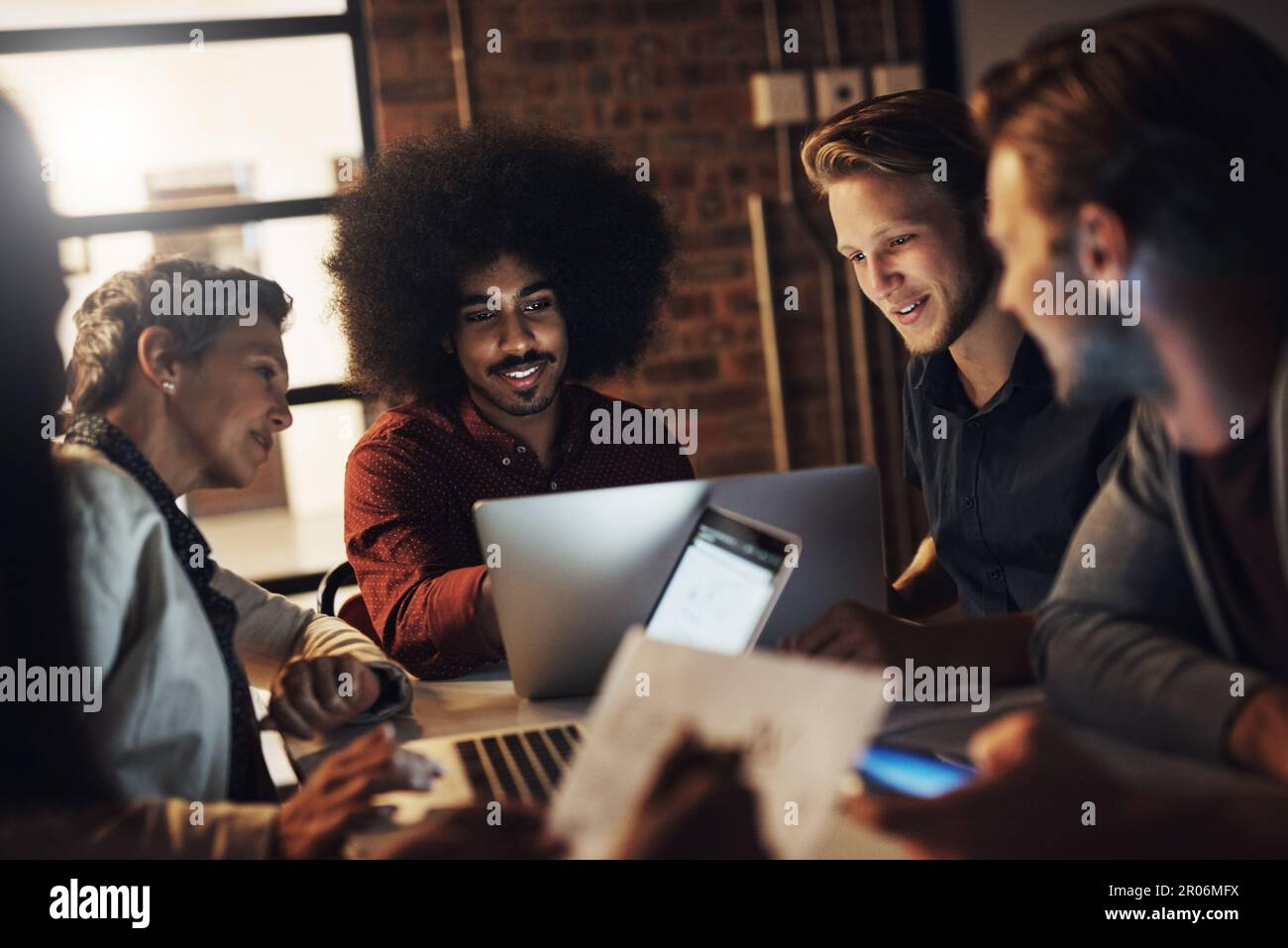 Theyre a team of creatives. a group of designers having a brainstorming ...