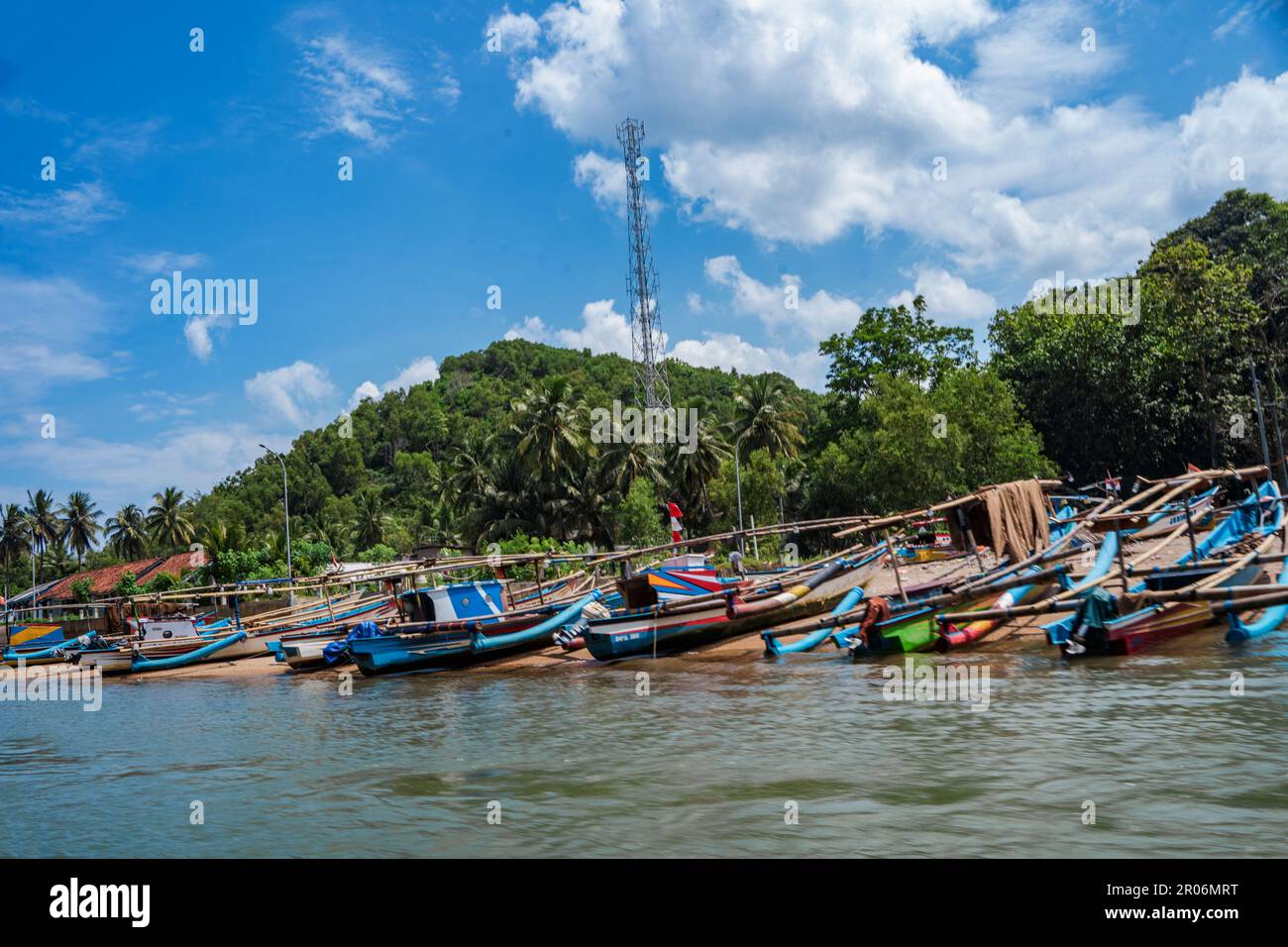Local fishermen boats line up by the Kali Cokel or Cokel River, Pacitan ...