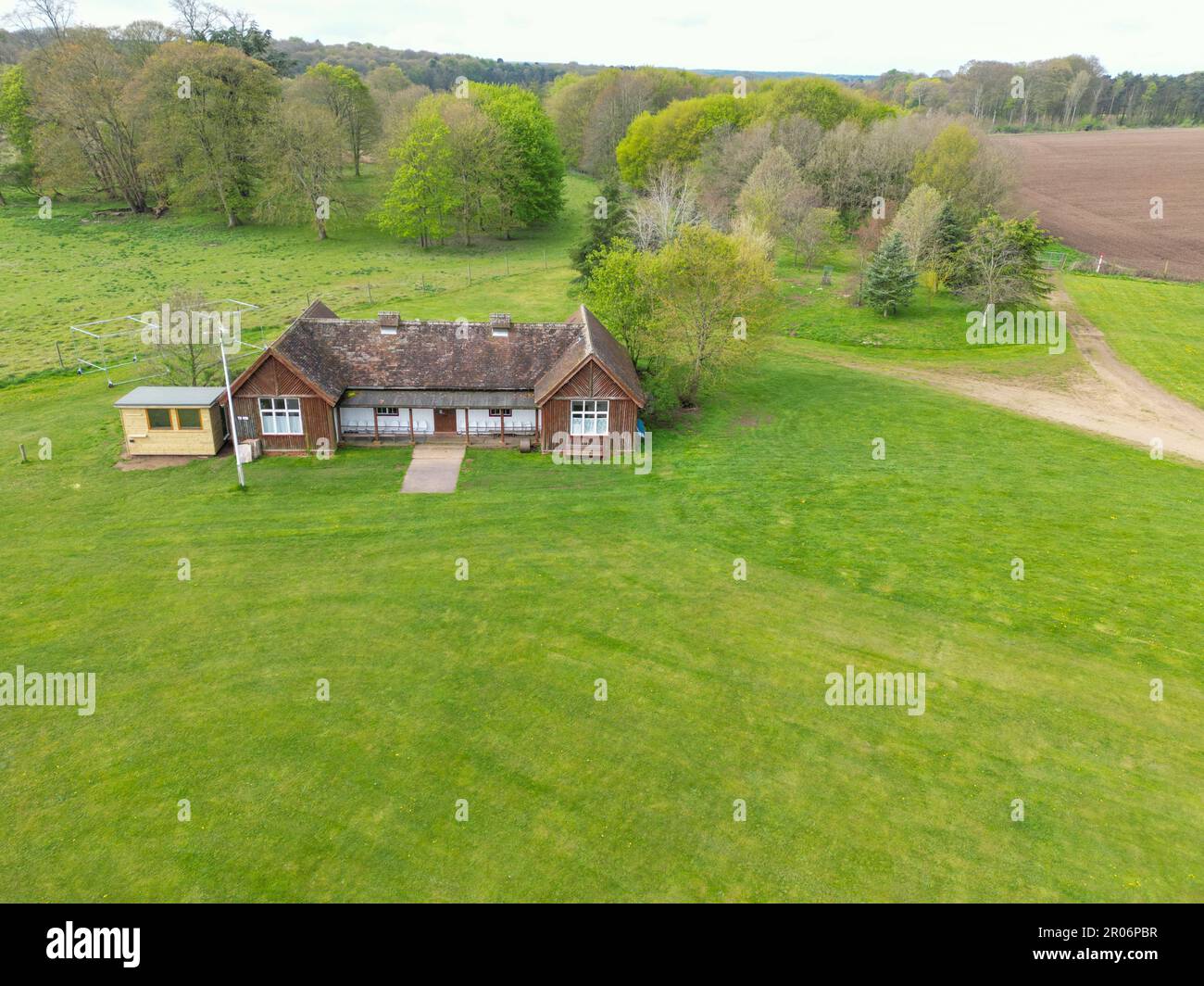 Drone aerial view of a mostly timber cricket pavilion seen at the edge ...