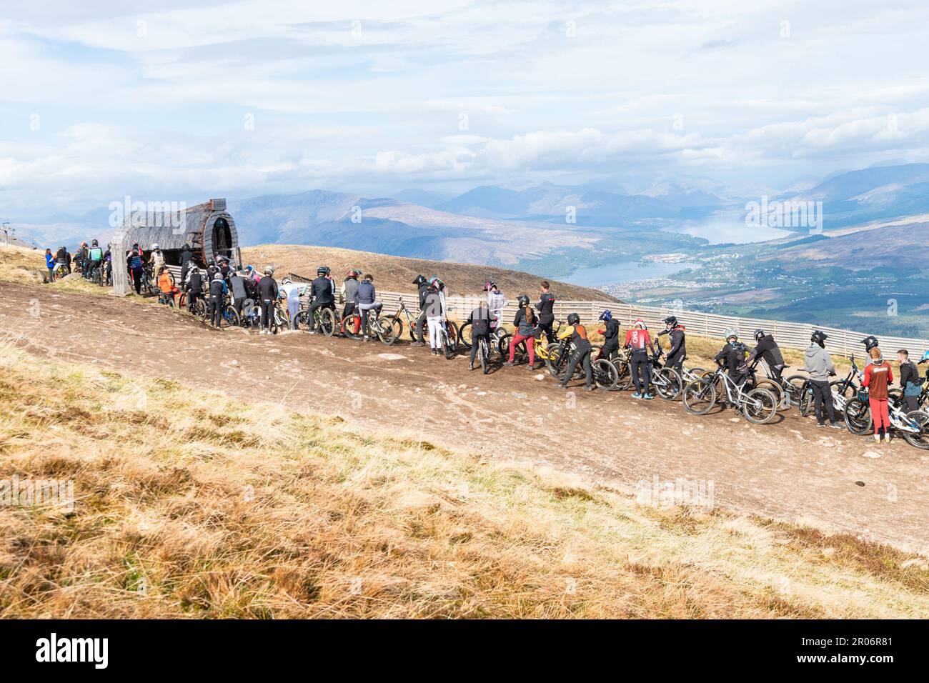 Fort William, Scotland, UK. 7th May, 2023. Mountainbike competitors queue at the start line for ...