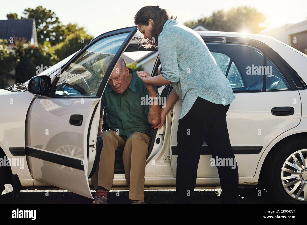 Man helping woman out of car hi-res stock photography and images - Alamy