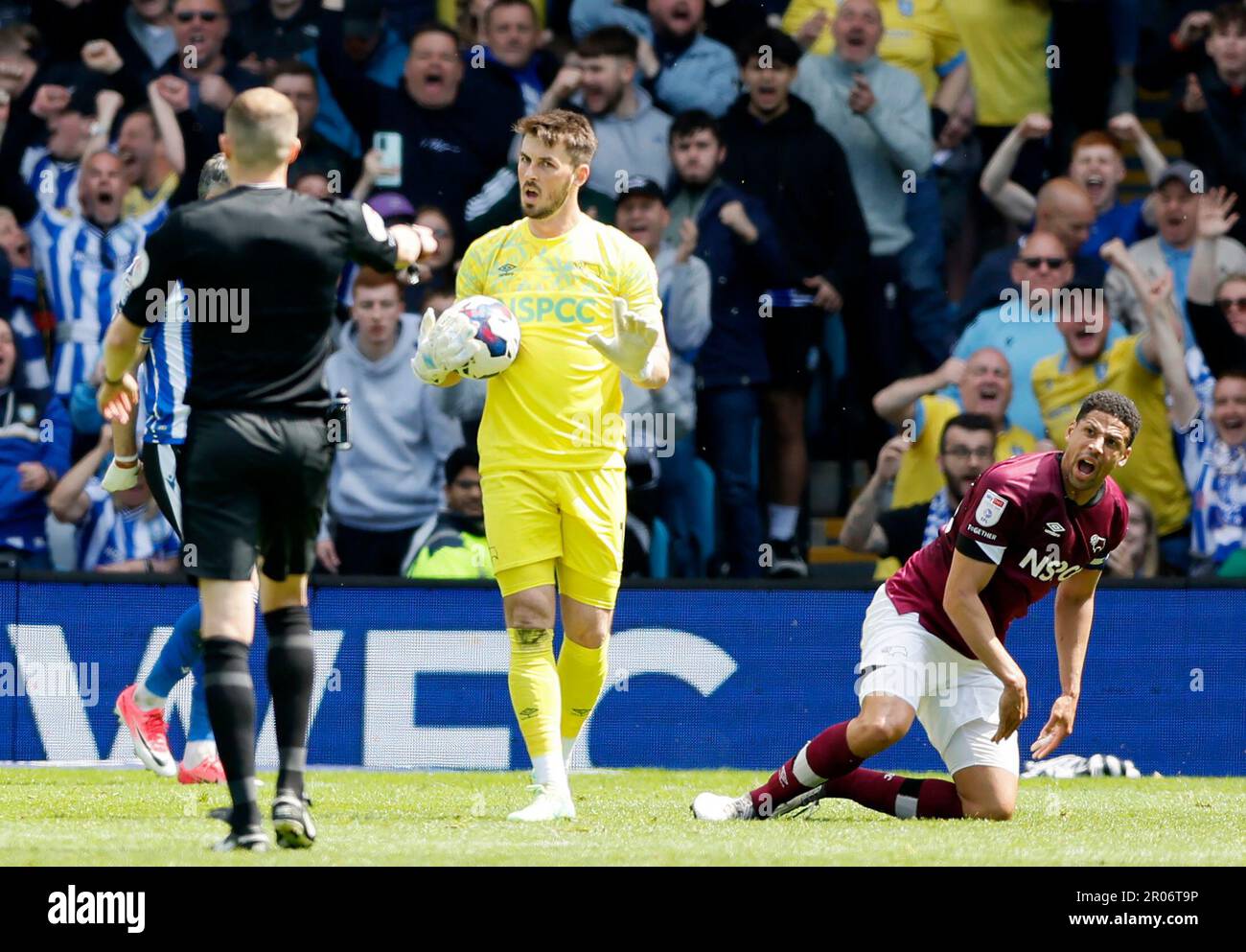 Referee Leigh Doughty shows a red card to Derby County's Curtis Davies ...