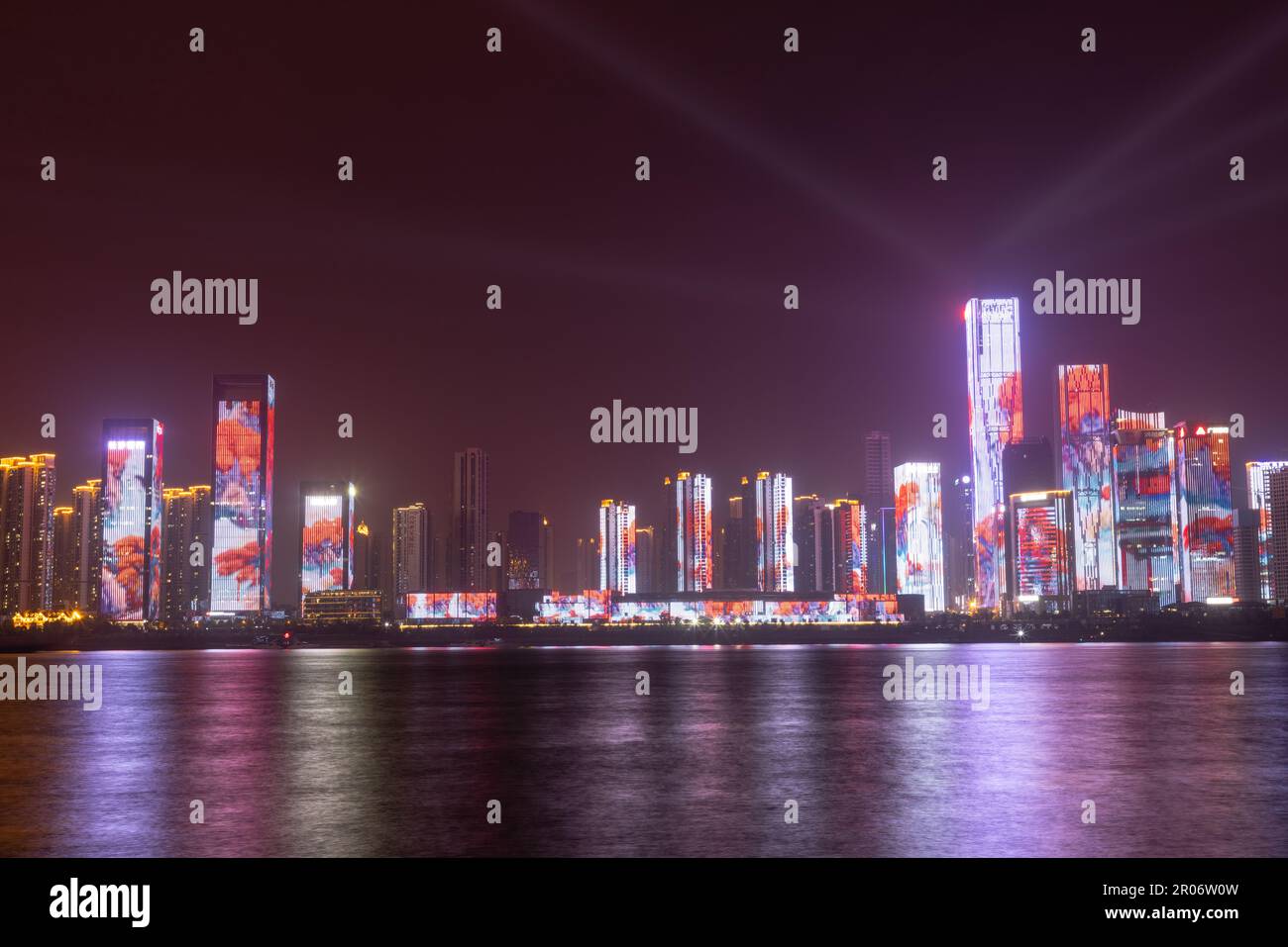 night view of high-rise buildings along Liuyang River near the junction ...