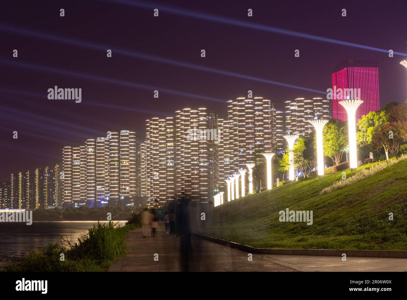 night view of high-rise buildings along Liuyang River near the junction ...