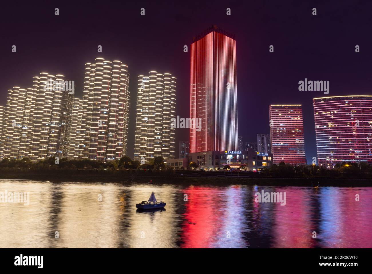 night view of high-rise buildings along Liuyang River near the junction ...