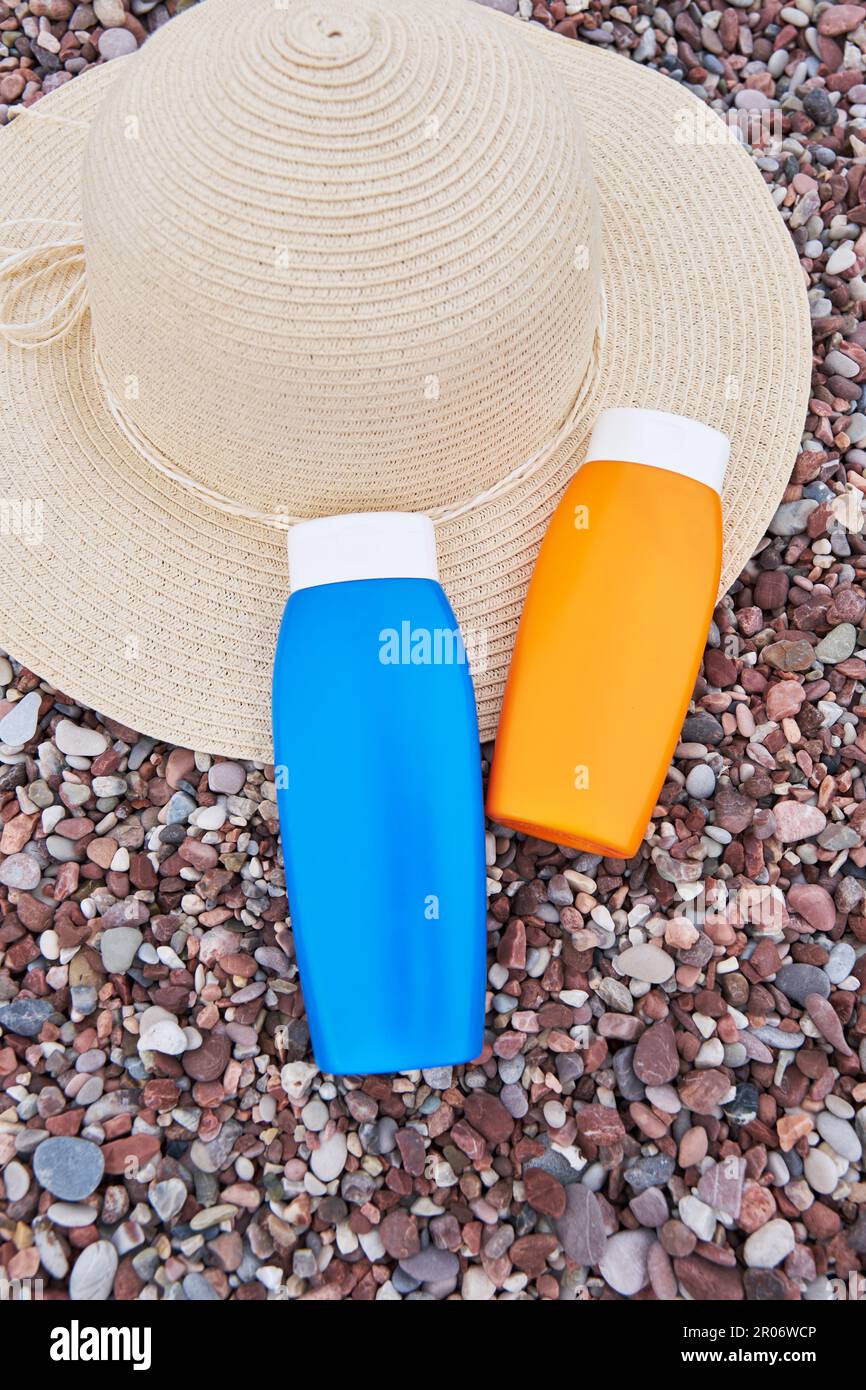 Templates of tubes of sunscreen lotion or sunblock cream and hat. Spf ...