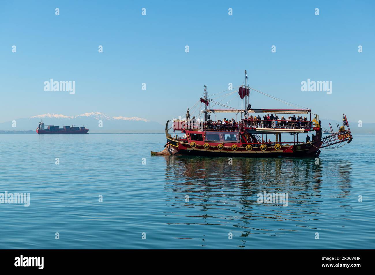 A group of people embarking on a boat journey in Thessaloniki, Greece ...