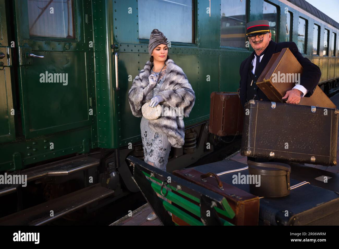 Reenactment scene on the platform near an authentic 1927 first class ...