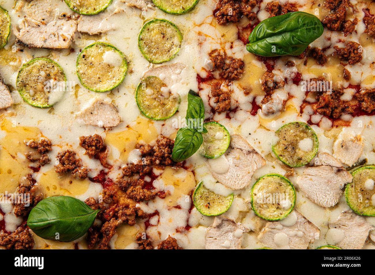 Big assorted pizza with variety of toppings Stock Photo - Alamy