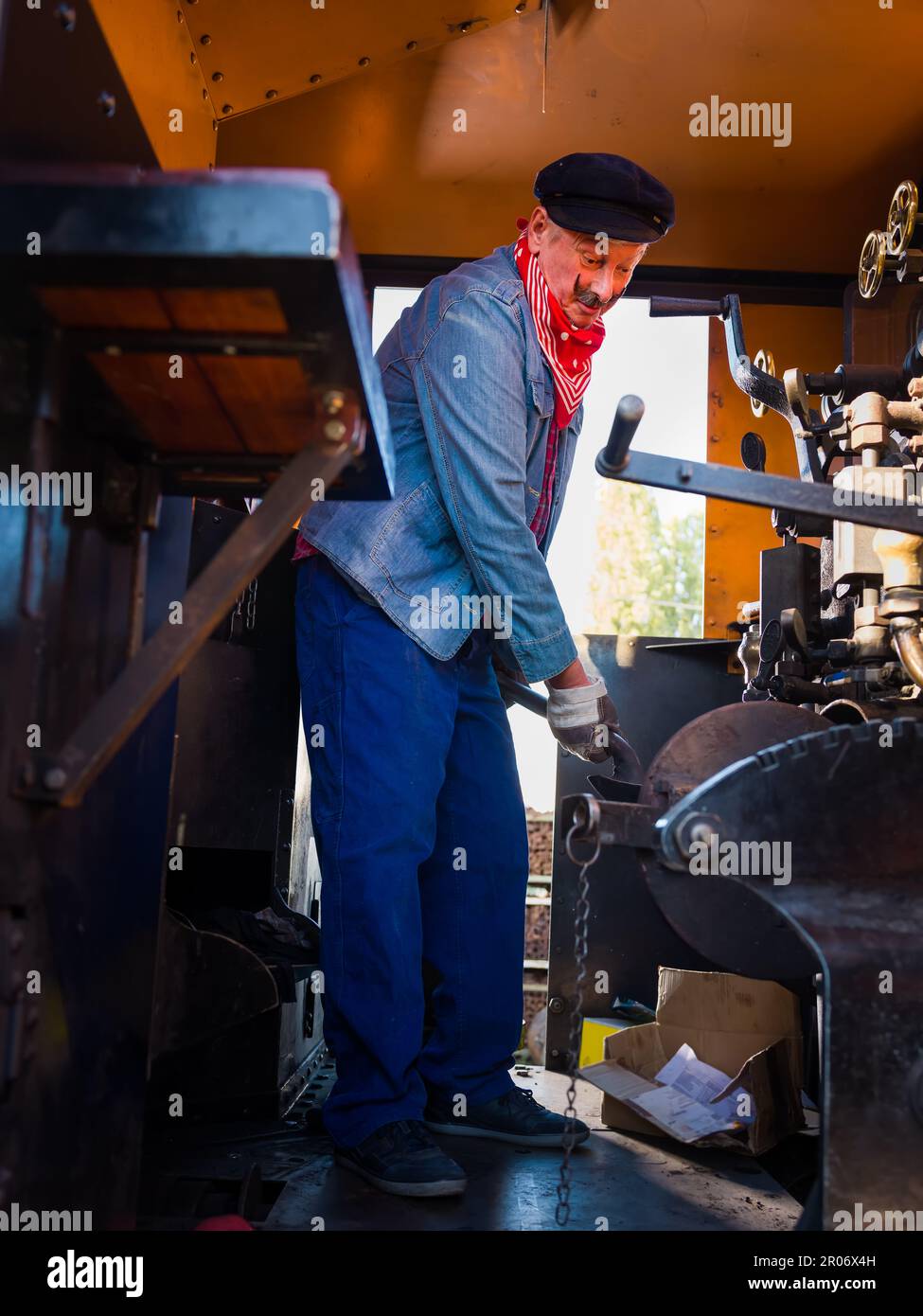 Reenactment scenes of a vintage worker or machinist in an authentic ...