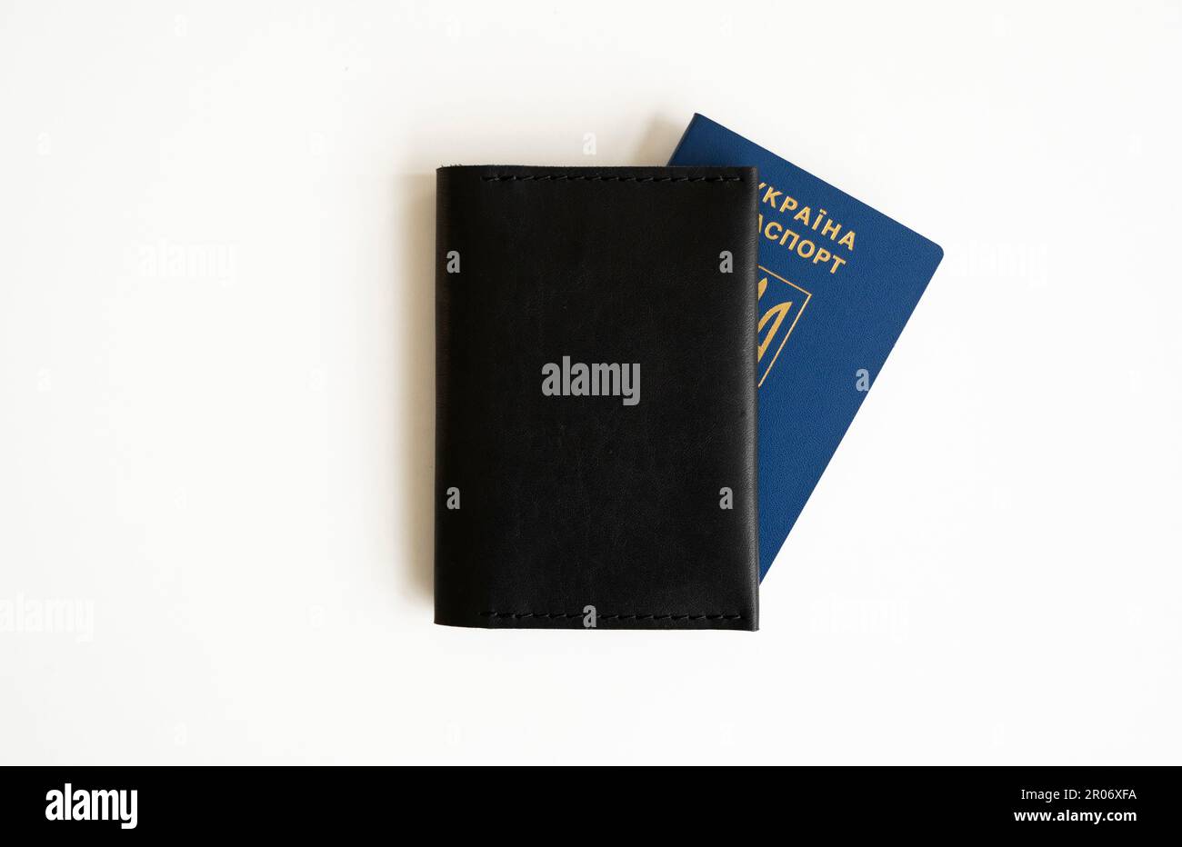 Ukrainian biometric passport id with a genuine leather cover on a white ...