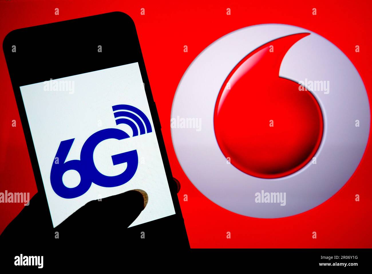 In this photo illustration, a 6G logo is seen displayed on a smartphone with a Vodafone logo in ...