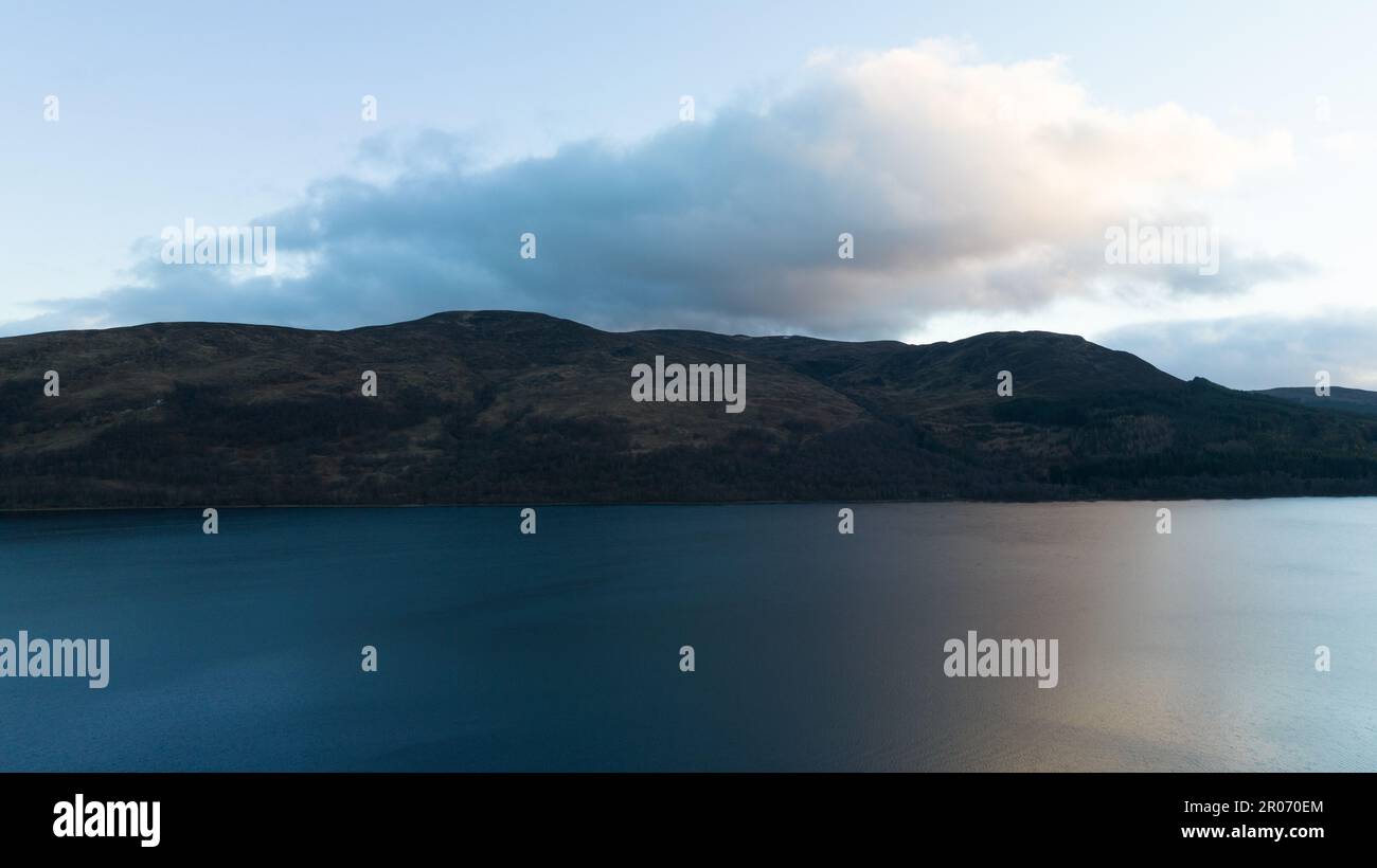 wonderful lake and sky view. Blue lake among the mountains and clouds ...