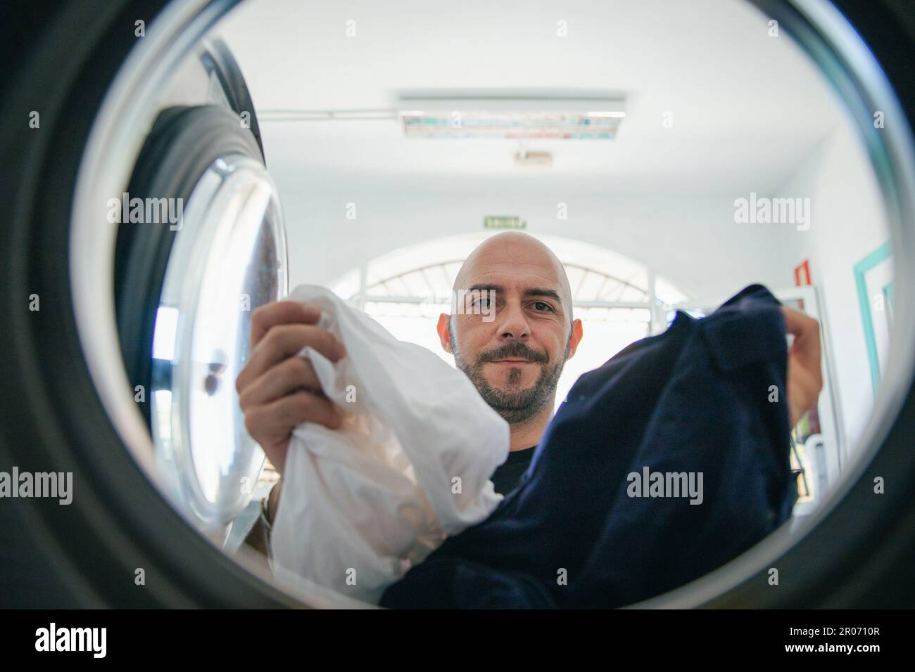Man washing clothes by hand hi-res stock photography and images - Alamy