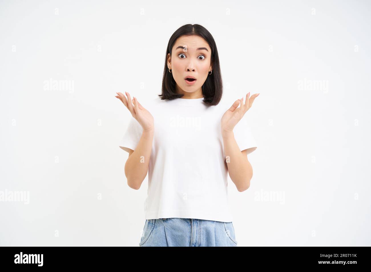 Portrait of woman with surprised face, clap hands, gasps and drops jaw ...