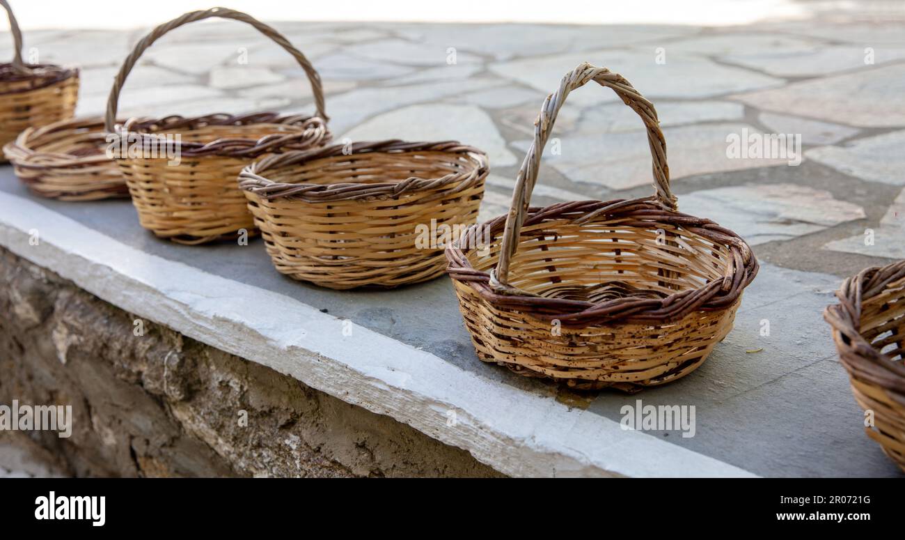 Woven handmade basket for sales on paved street at Cyclades island ...