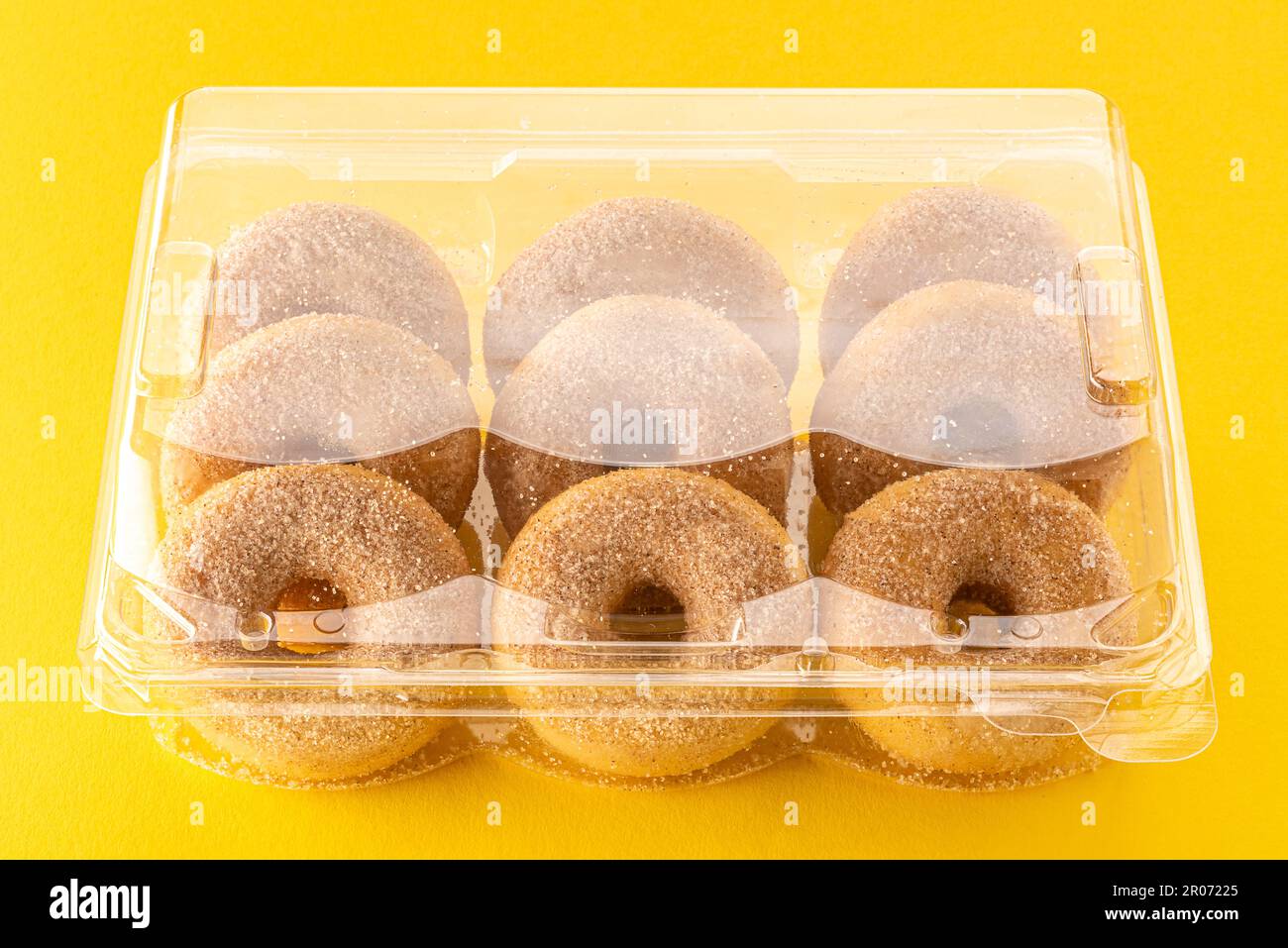 Donuts or Doughnuts with sugar in transparent plastic box for sale on ...