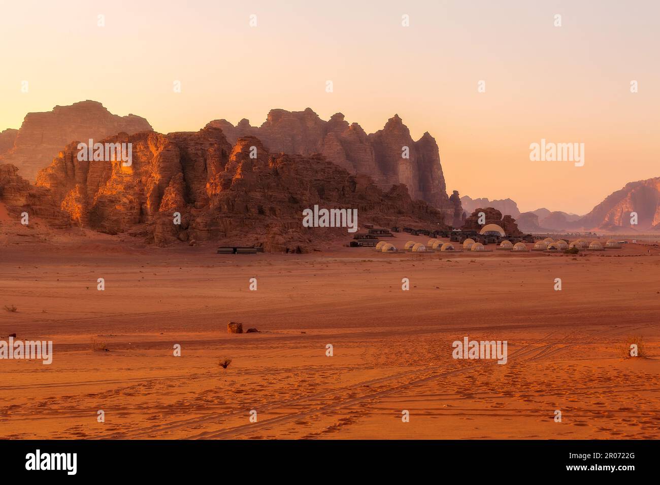 Camp site tents at Wadi Rum Desert, Jordan and red rocks sunset ...