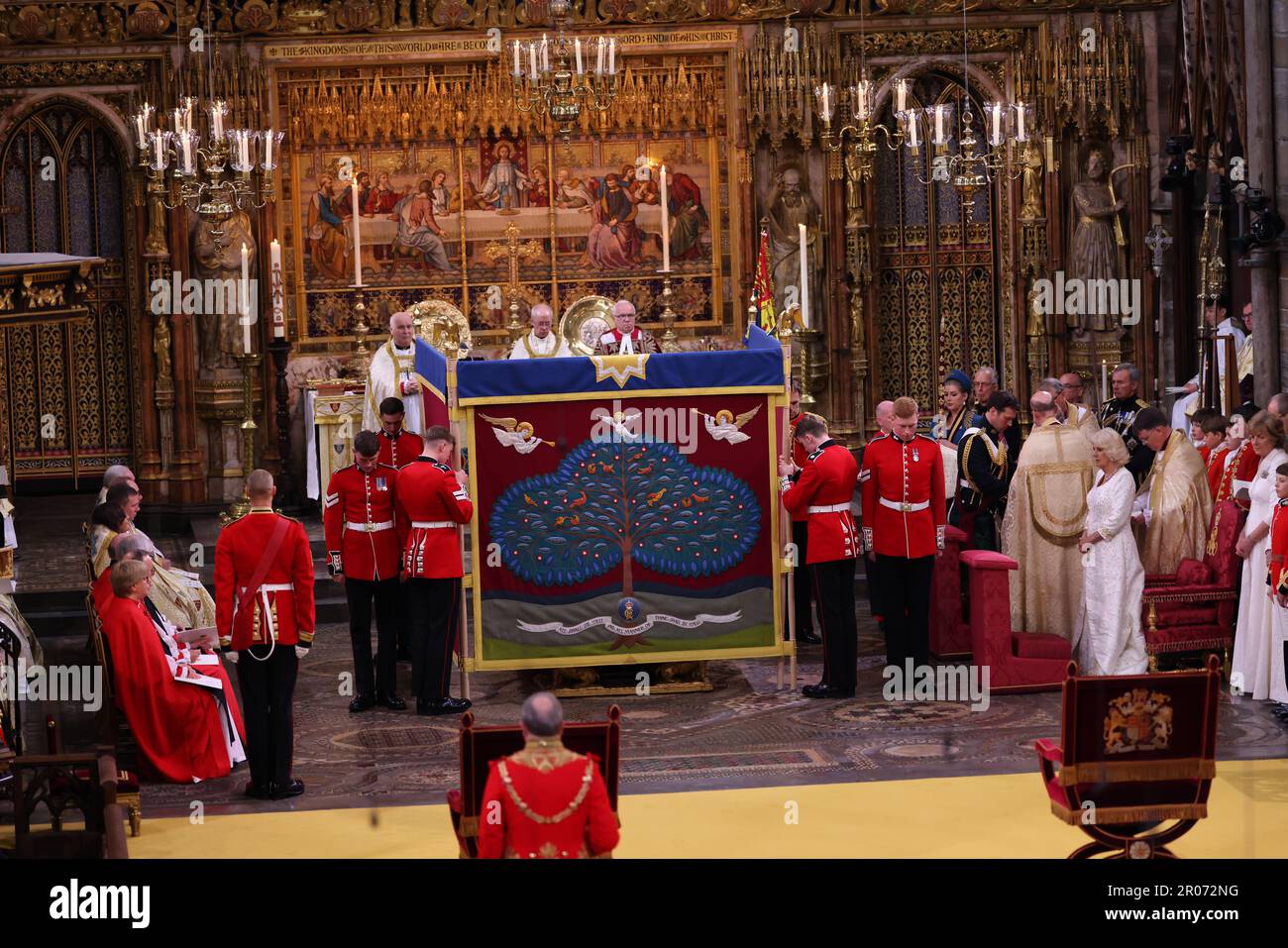 Queen Camilla (right) watches as King Charles III is behind a anointing ...