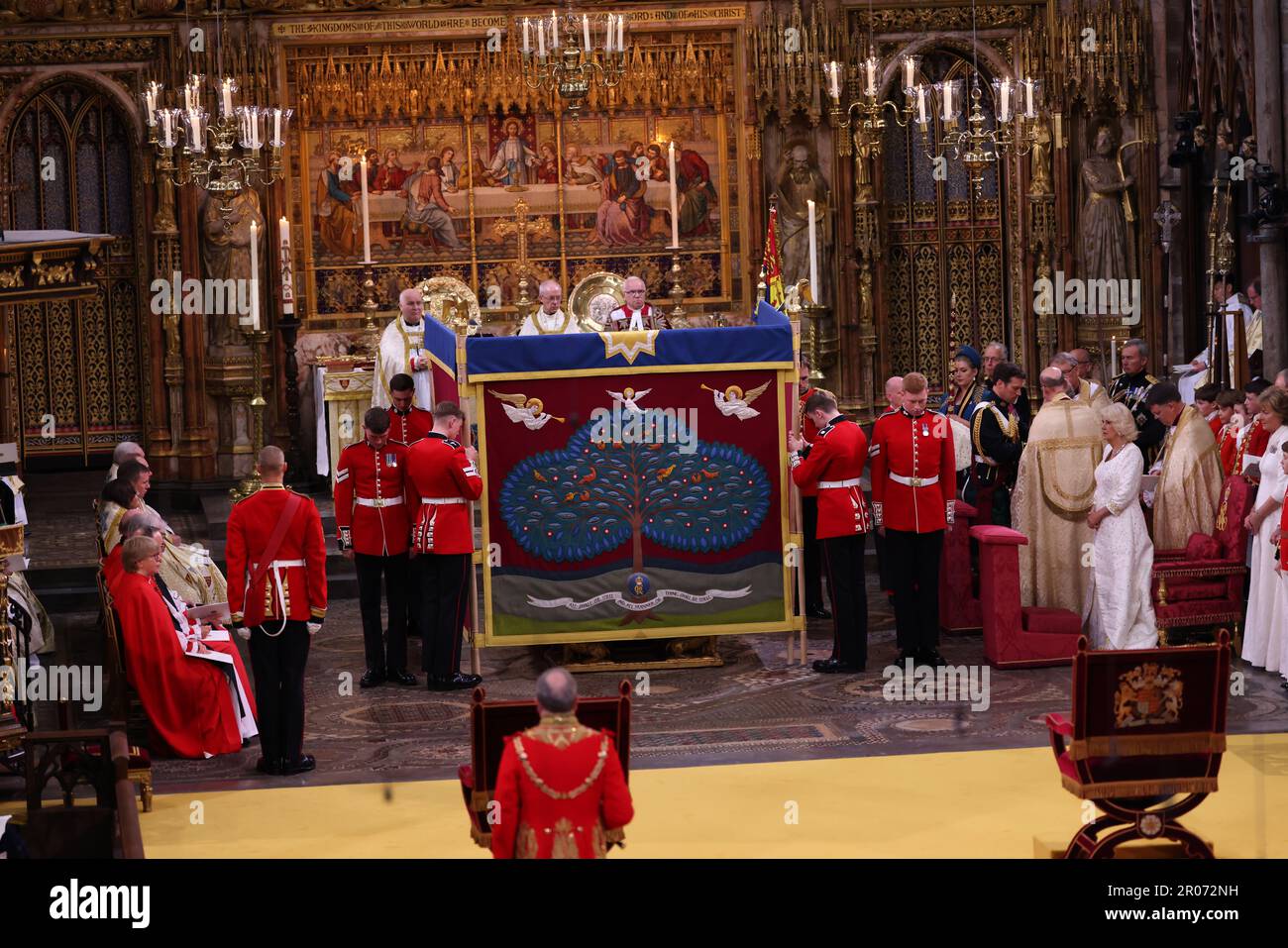 Queen Camilla (right) watches as King Charles III is behind a anointing ...