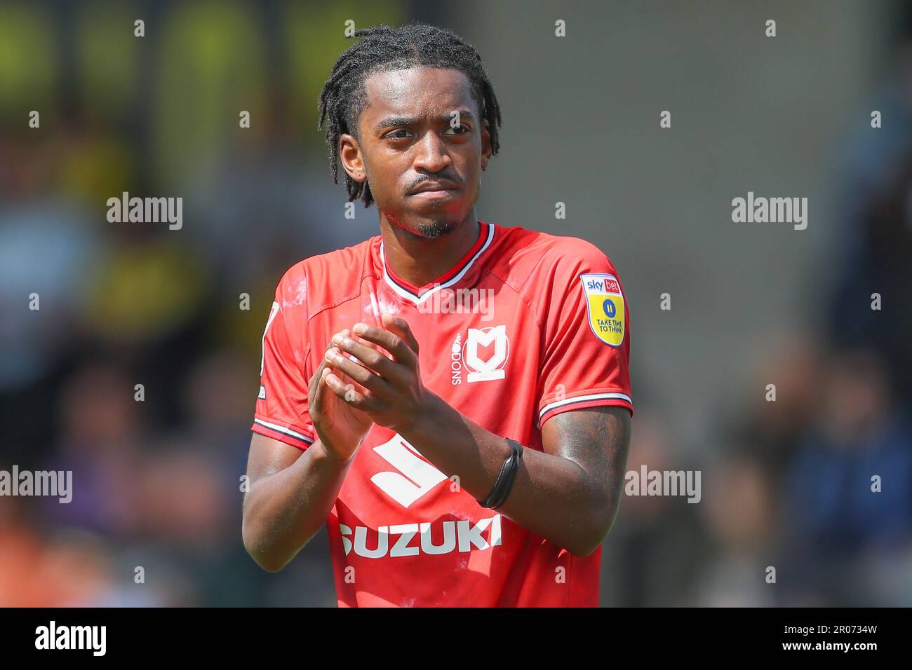 Paris Maghoma #42 of Milton Keynes Dons applauds the travelling fans ...
