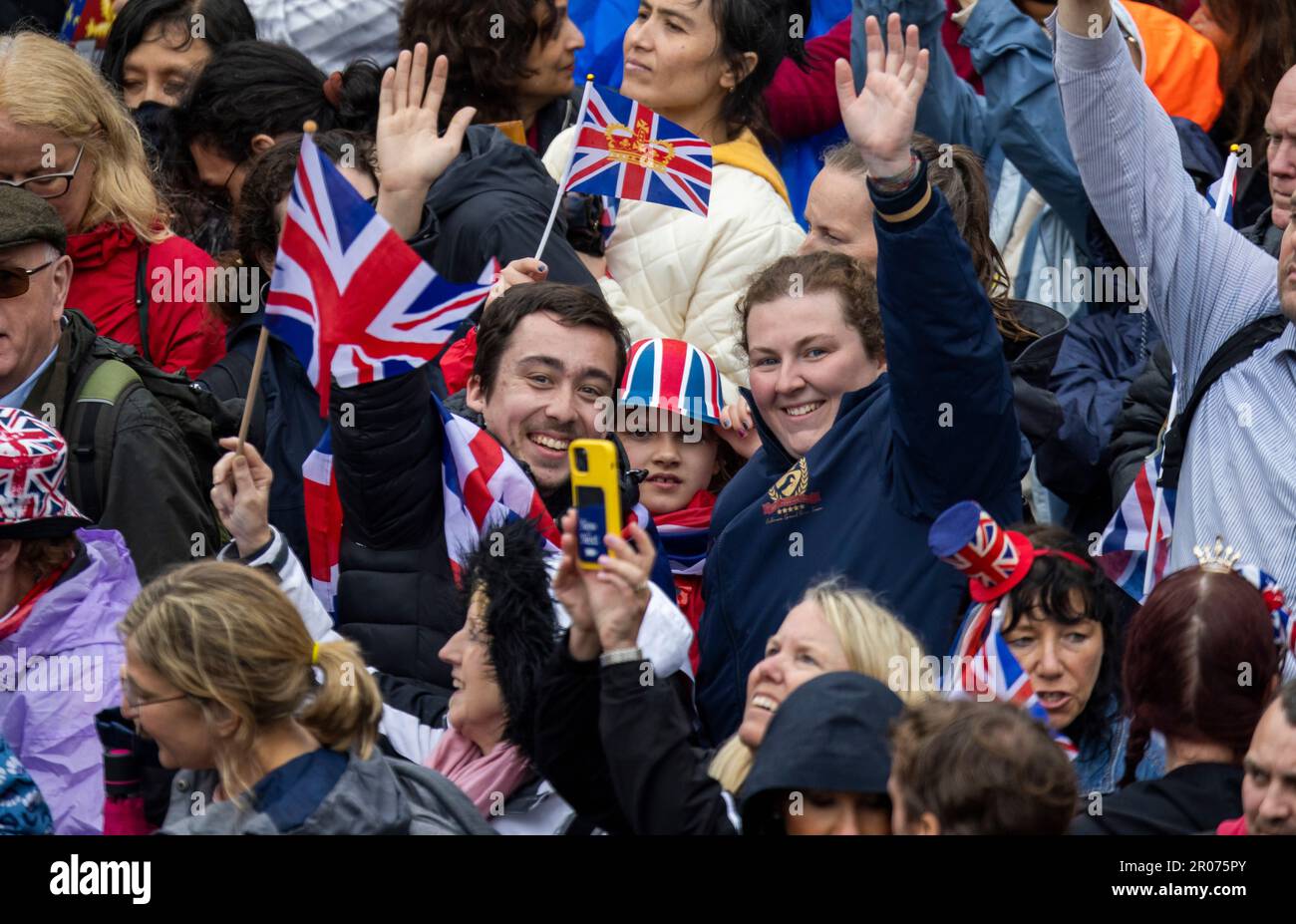 Members of the public walk up The Mall after the Coronation Procession ...