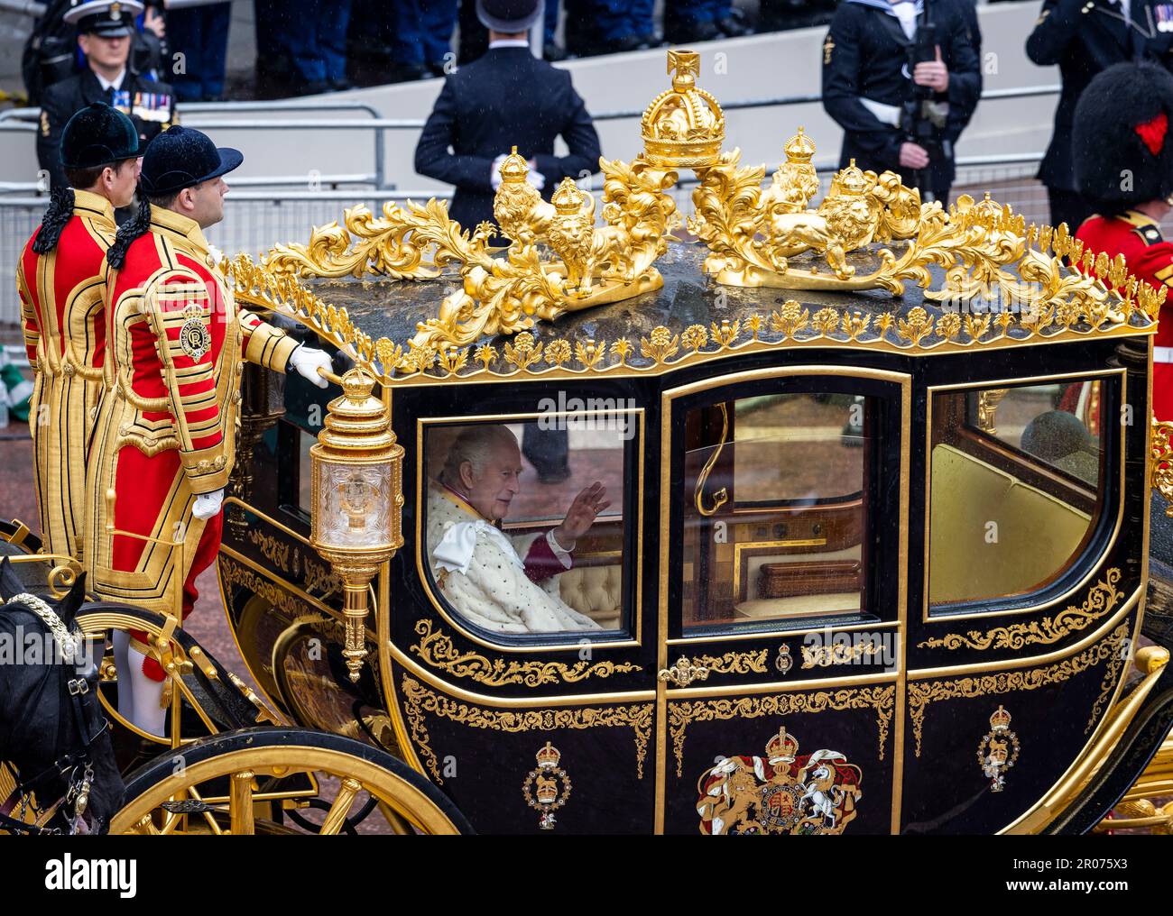 King Charles III waves as he is carried in the Diamond Jubilee State ...